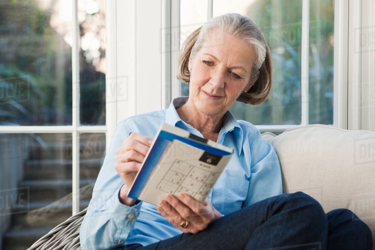 Senior Woman Doing Sudoku Puzzles Stock Photo Dissolve senior-woman-doing-sudoku-puzzles-stock-photo-dissolve