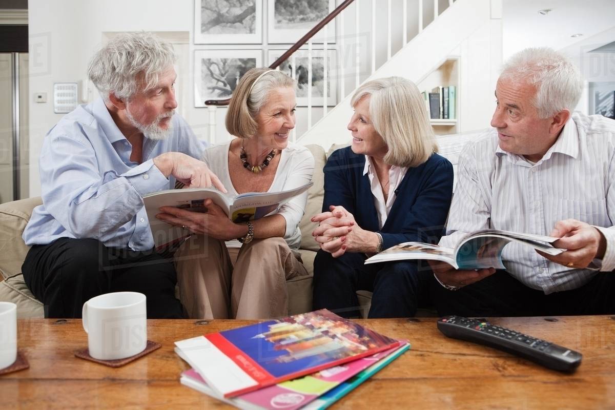 Senior friends planning holiday - Royalty-free Stock Photo | Dissolve