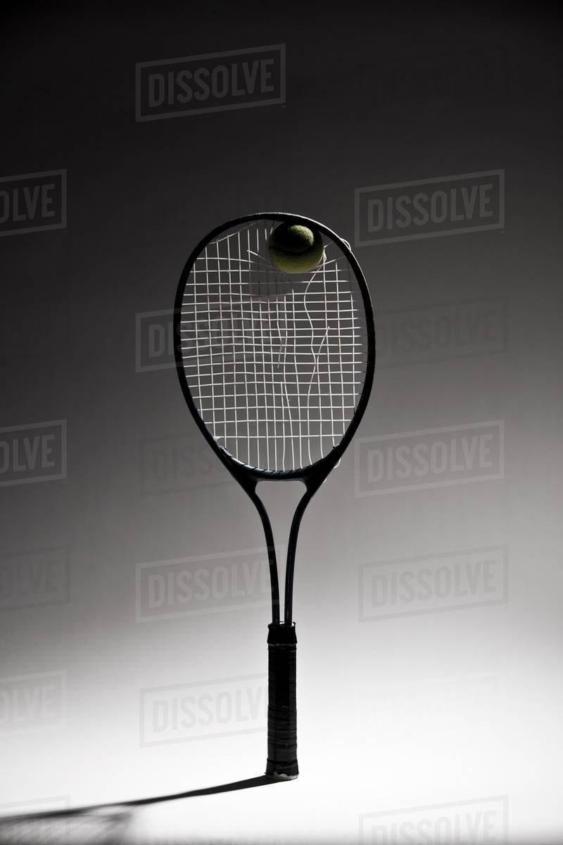 Ball in tennis racket - Royalty-free Stock Photo | Dissolve