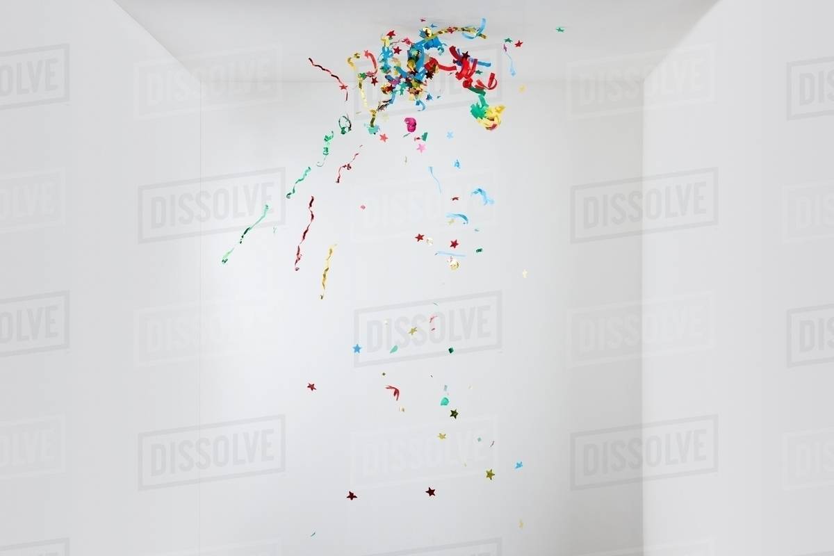 Streamers and confetti in mid air - Royalty-free Stock Photo | Dissolve