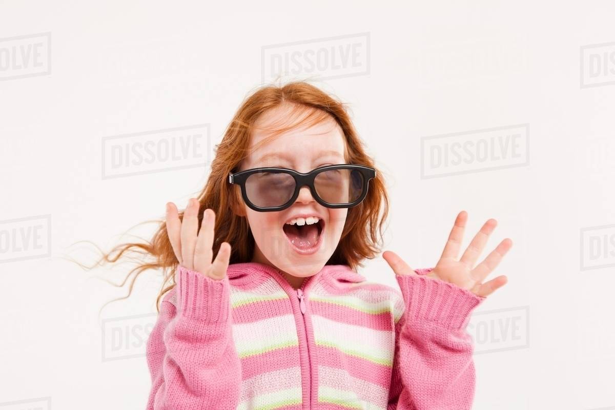 Girl wearing 3D glasses - Stock Photo - Dissolve