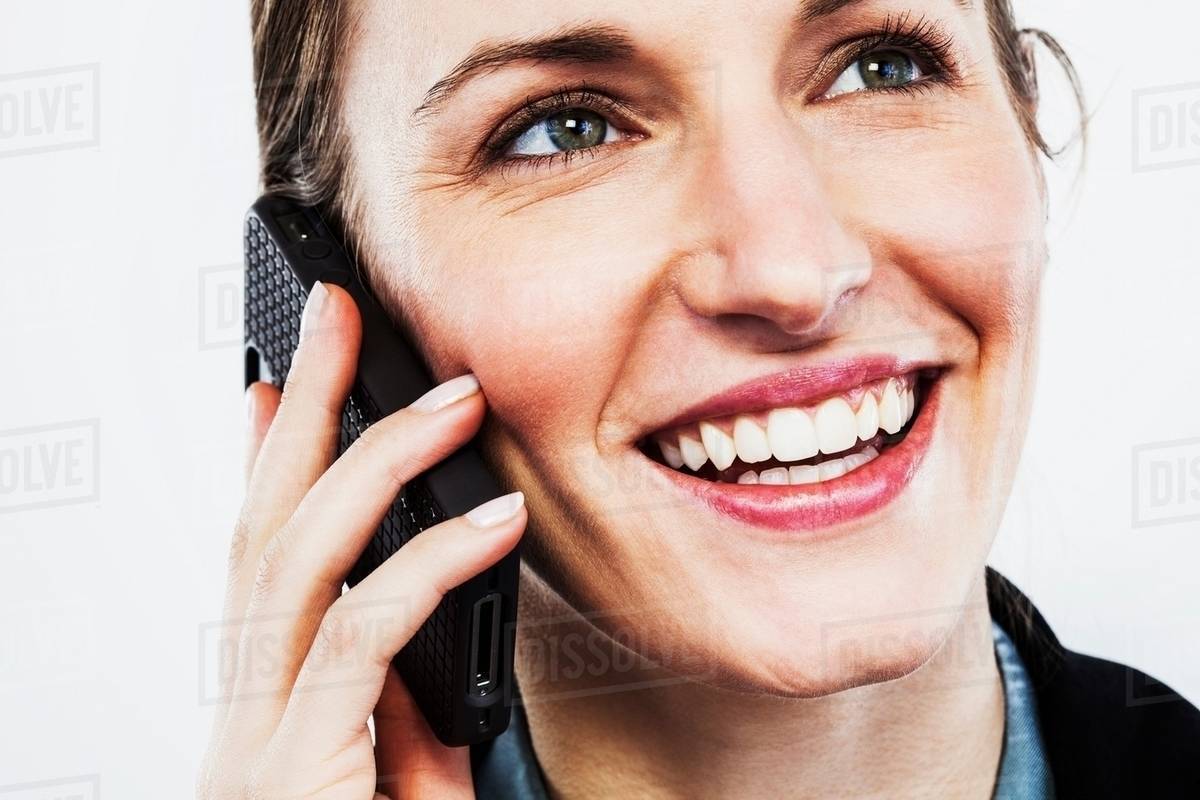 Young woman on smartphone - Royalty-free Stock Photo | Dissolve