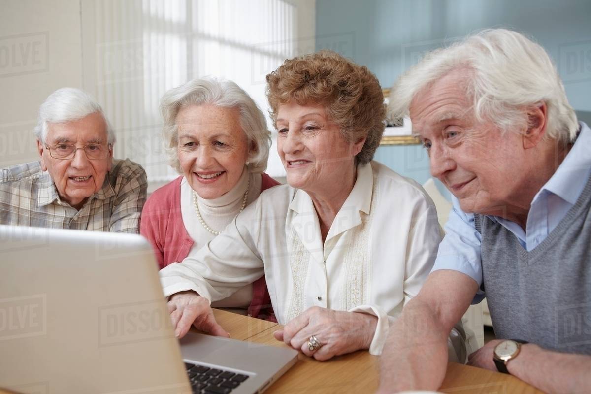 Senior adults using laptop - Stock Photo - Dissolve