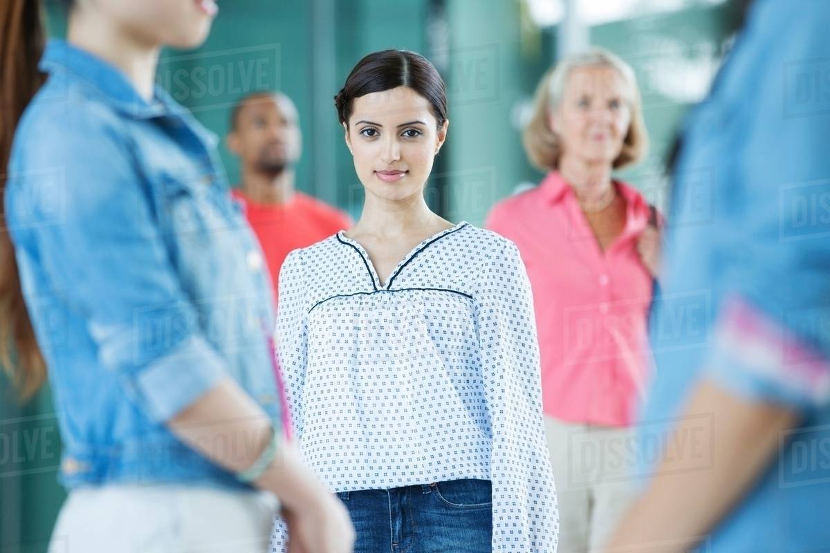 Young woman in crowd - Royalty-free Stock Photo | Dissolve