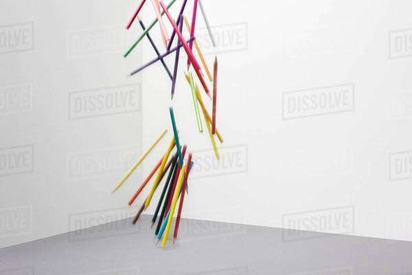 Coloured pencils falling - Royalty-free Stock Photo | Dissolve