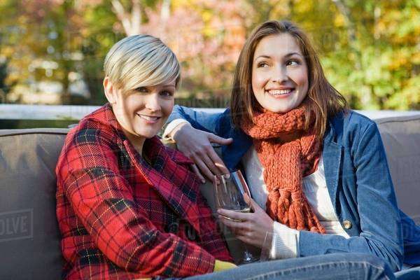 Friends sitting outside - Royalty-free Stock Photo | Dissolve