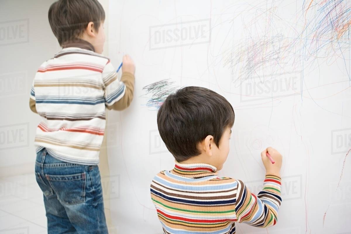 Boys drawing on a wall - Royalty-free Stock Photo | Dissolve