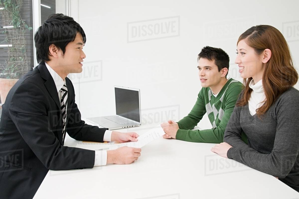 Businessman in a meeting with clients - Stock Photo - Dissolve