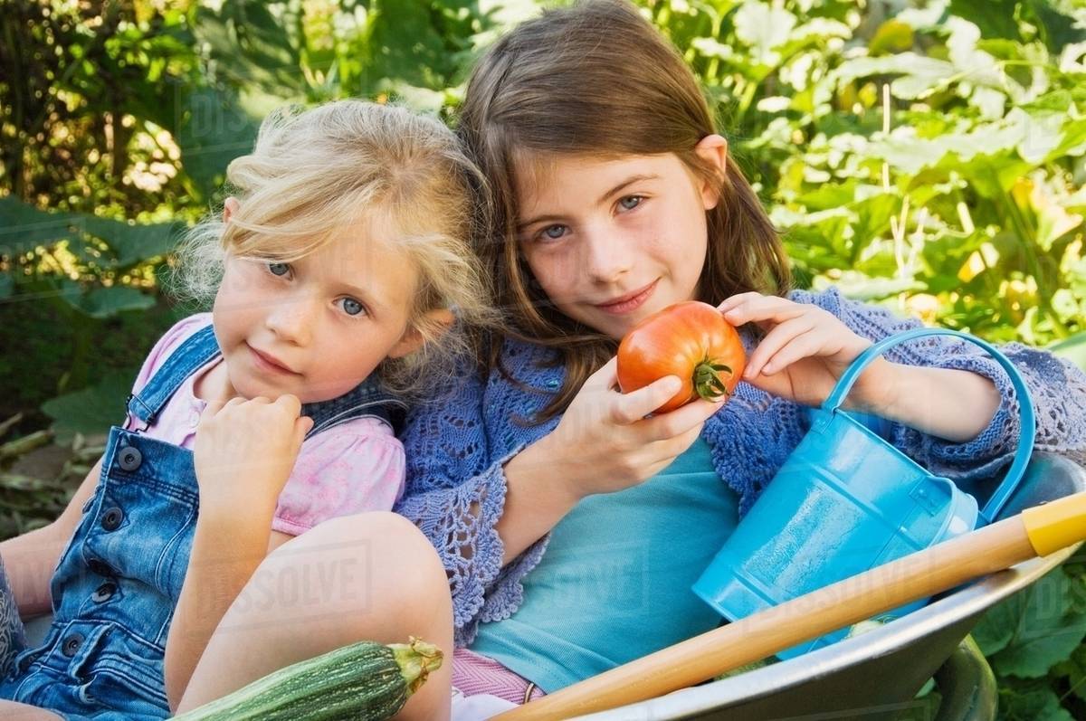 Girls in garden - Royalty-free Stock Photo | Dissolve