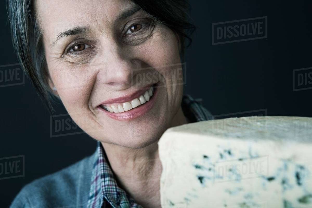 Woman with cheese - Stock Photo - Dissolve