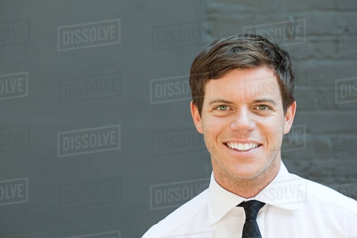 Portrait of young man in front of wall - Royalty-free Stock Photo ...