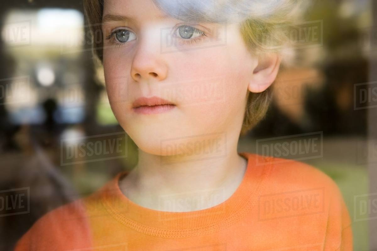 Boy through a window - Stock Photo - Dissolve