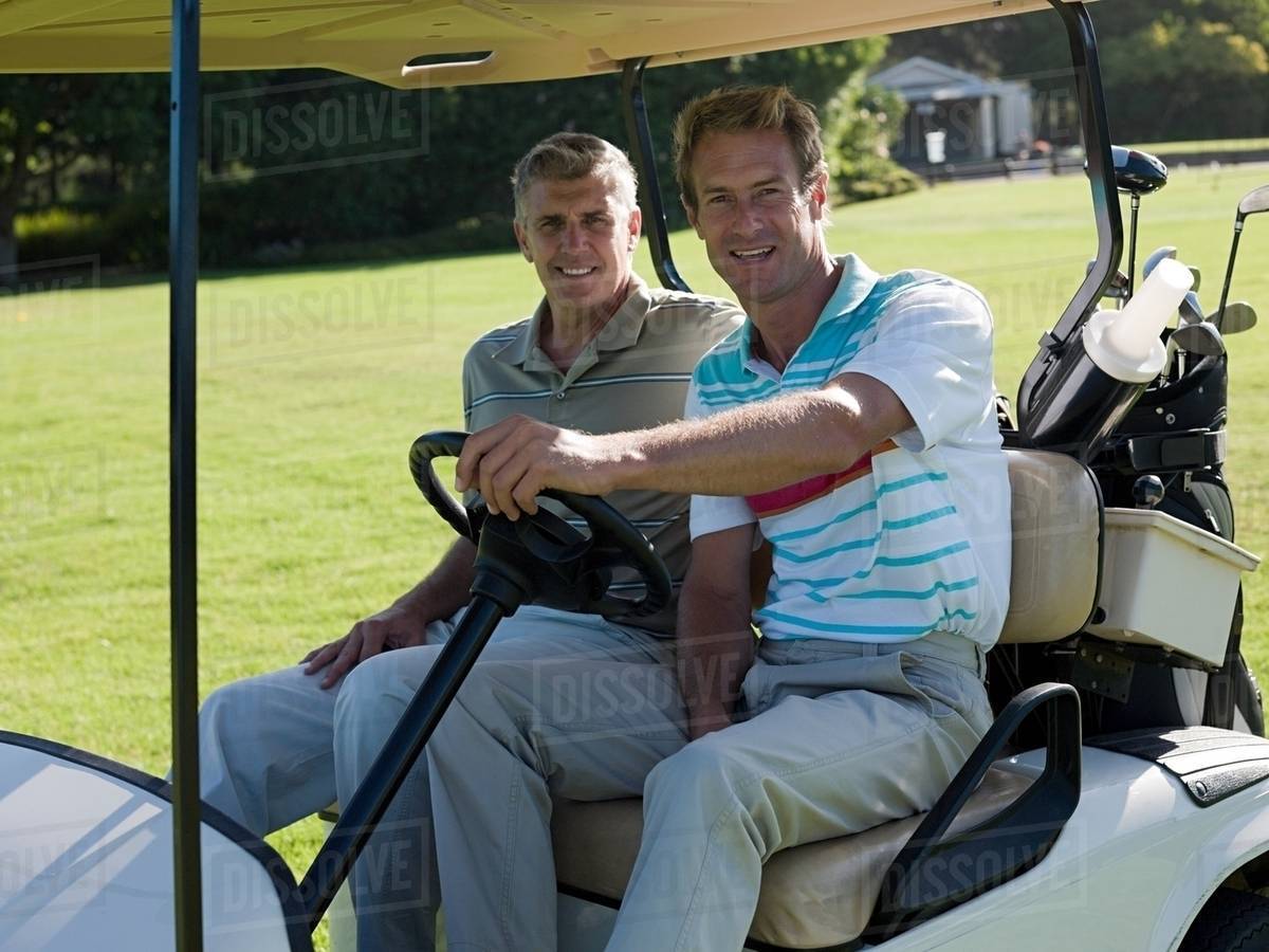 Two mature men in golf cart on golf course - Royalty-free Stock Photo ...