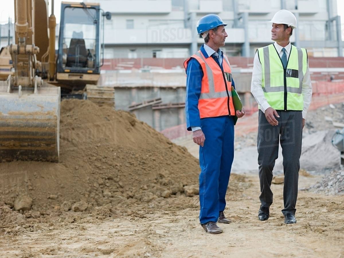 Mature men meeting on construction site - Royalty-free Stock Photo ...