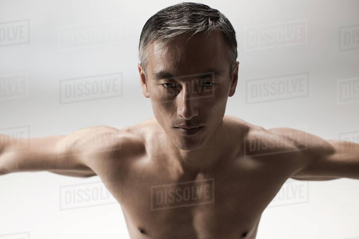 Muscular mature man, front view - Royalty-free Stock Photo | Dissolve