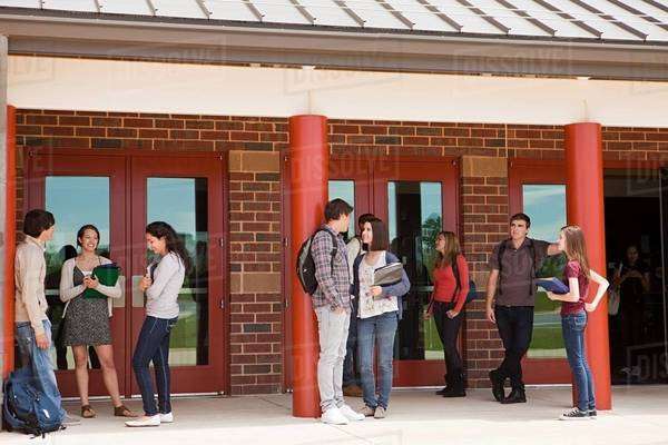 High school students outside school building - Royalty-free Stock Photo ...