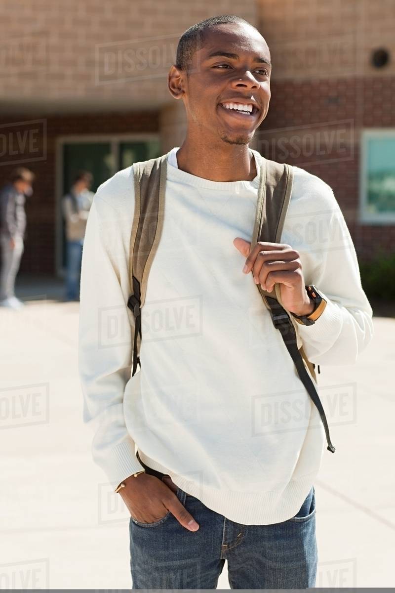 Male high school student outside school building - Royalty-free Stock ...