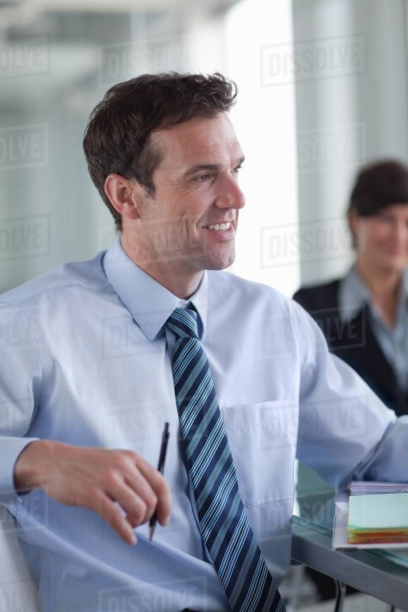 Businessman holding a pen - Royalty-free Stock Photo | Dissolve