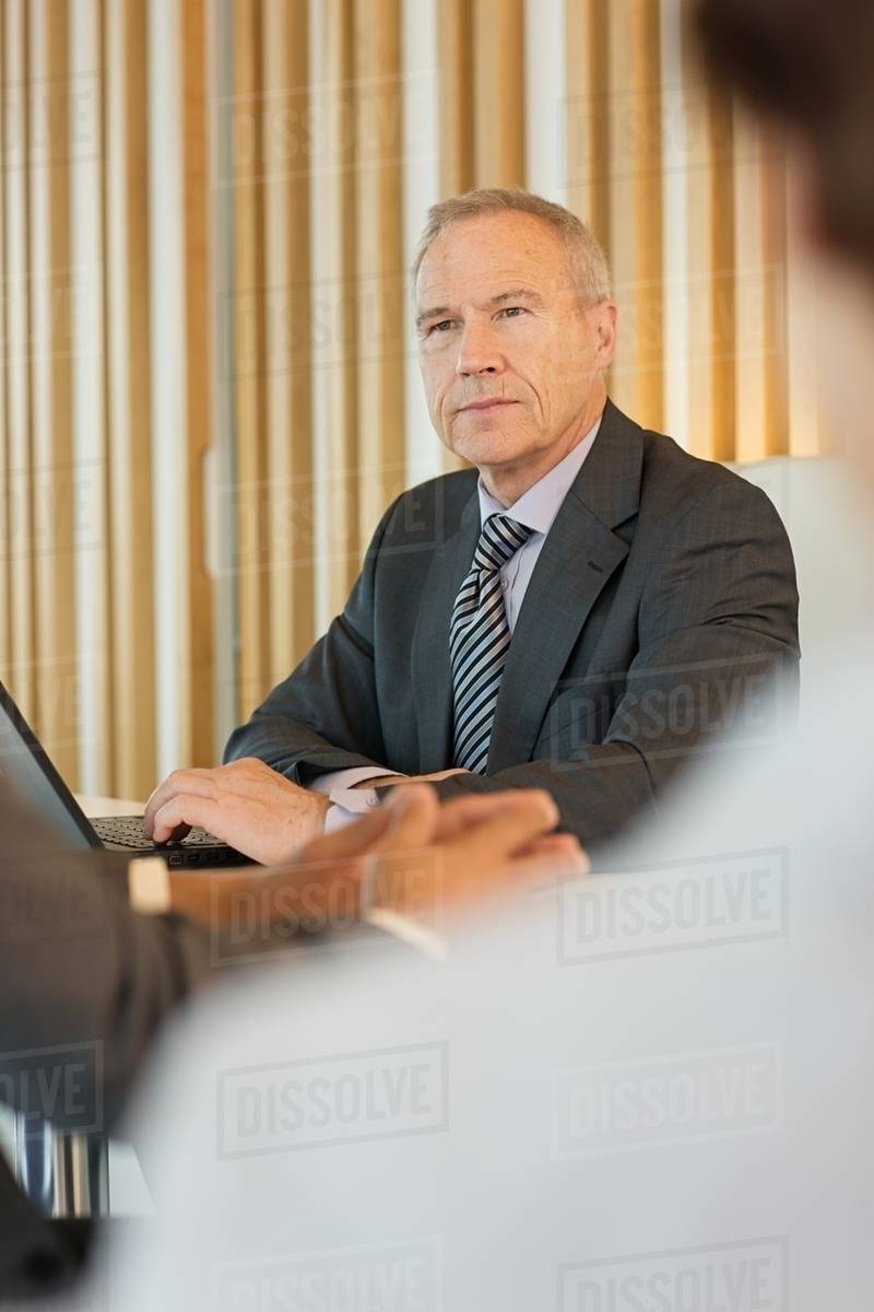 Businessman in meeting - Royalty-free Stock Photo | Dissolve