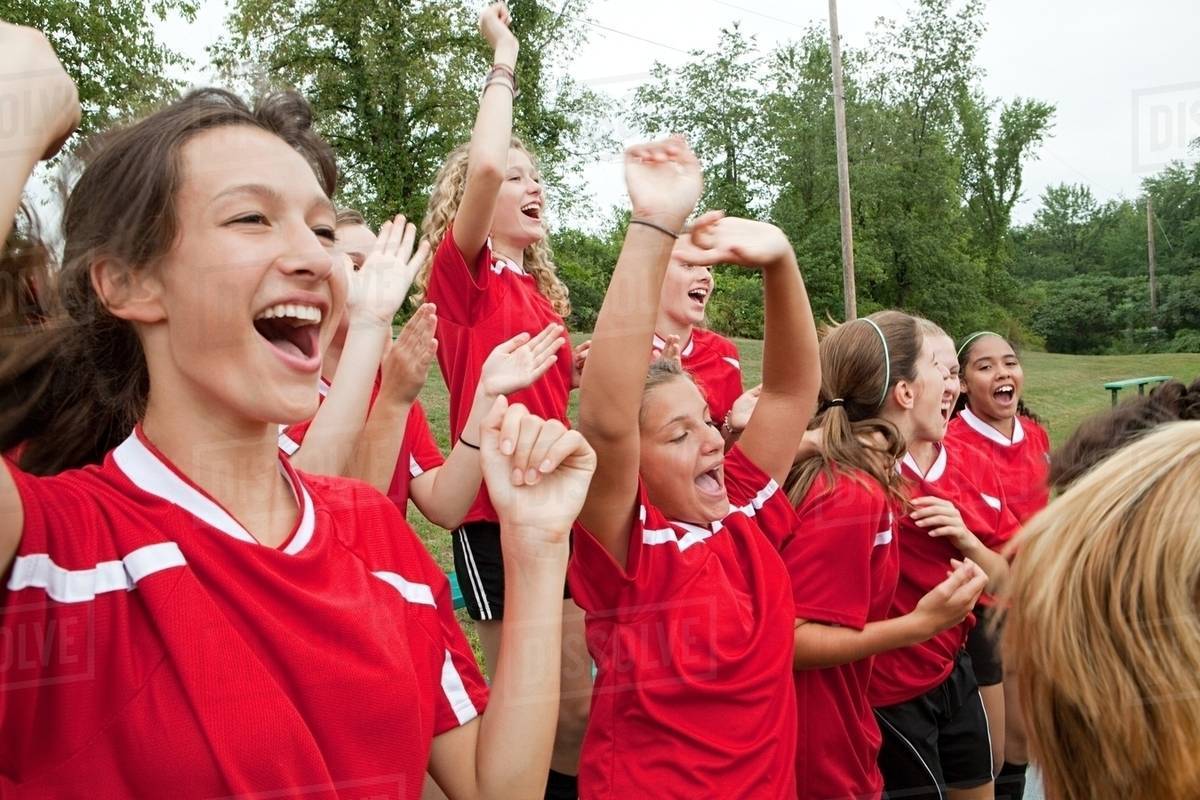 Female soccer players cheering - Royalty-free Stock Photo | Dissolve