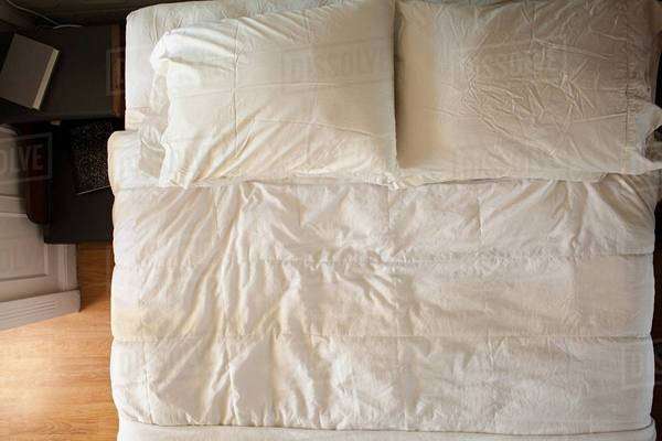 Overhead view of double bed - Royalty-free Stock Photo | Dissolve