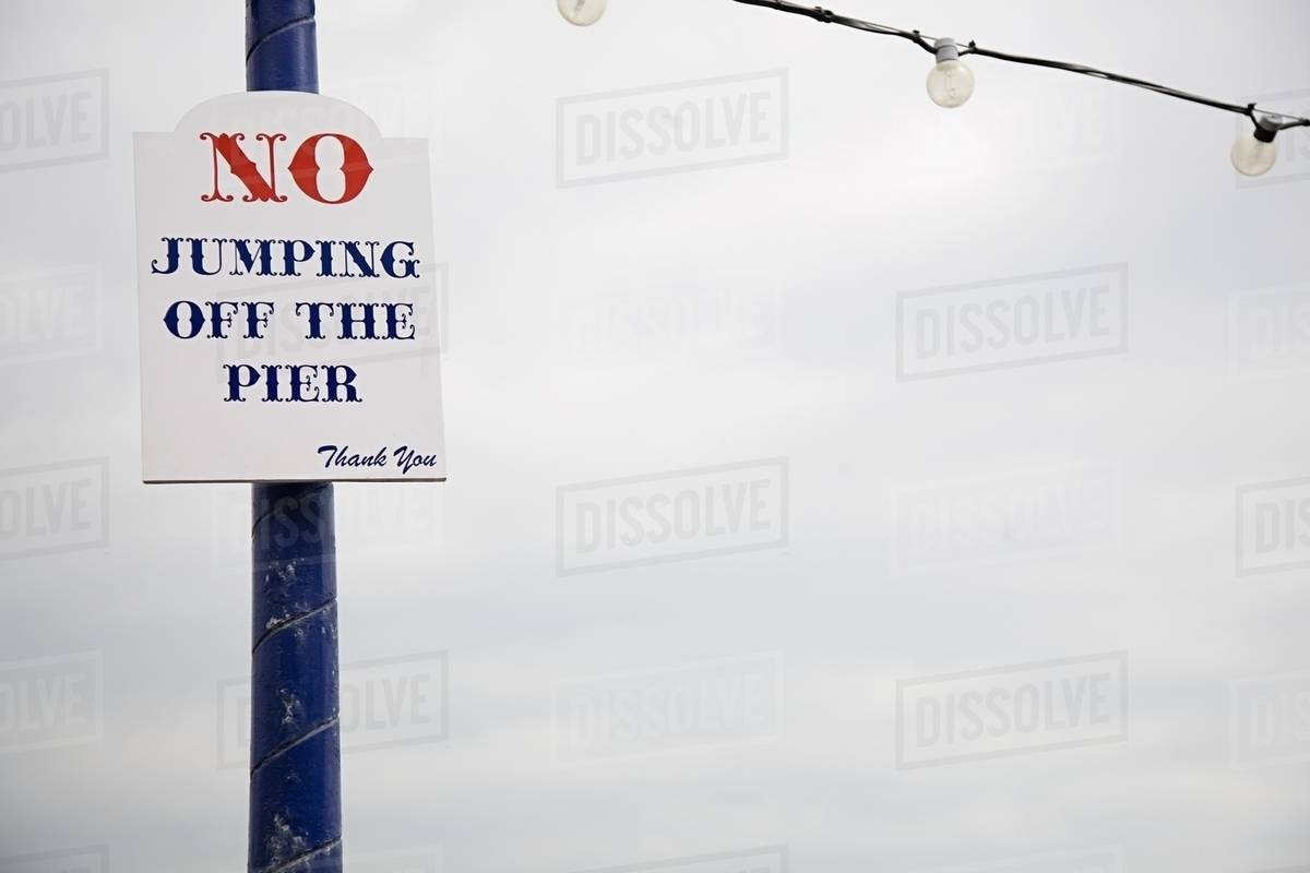 Warning sign on pier - Stock Photo - Dissolve