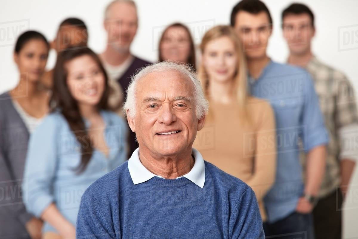 Portrait of man with group of people in background - Royalty-free Stock ...