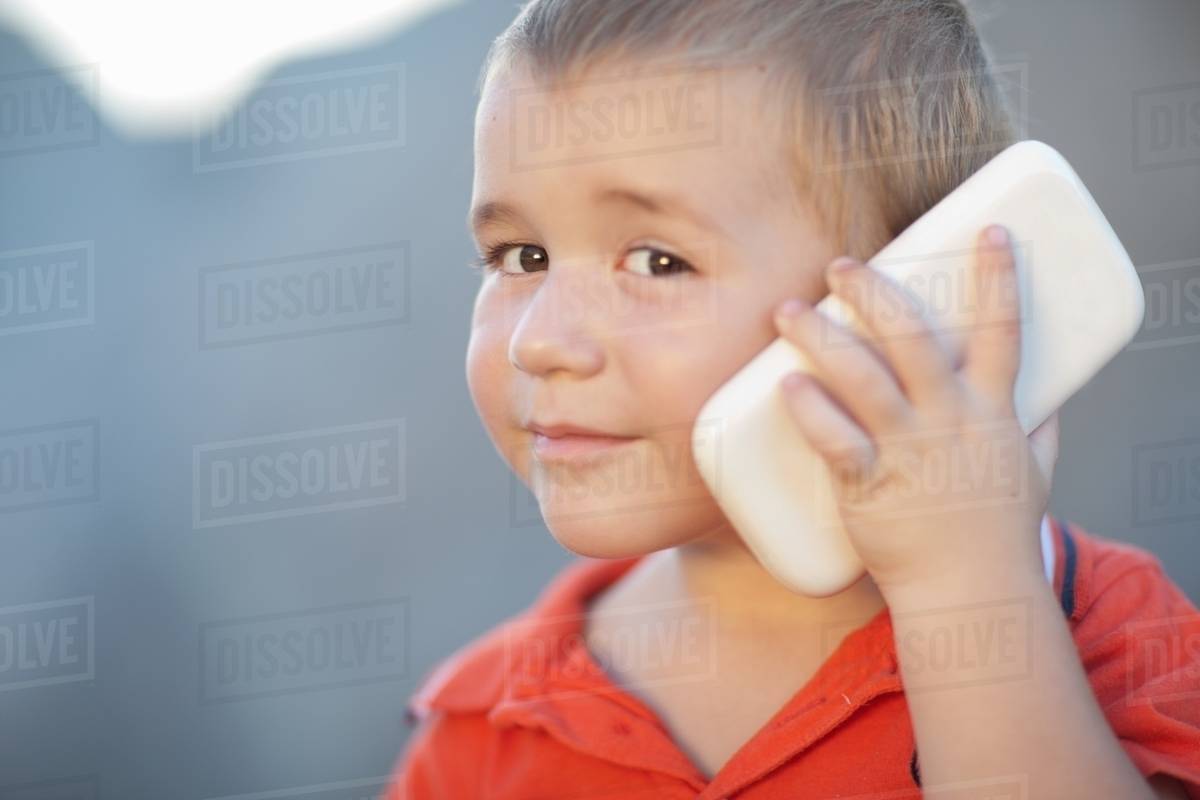 Boy using smartphone - Royalty-free Stock Photo | Dissolve