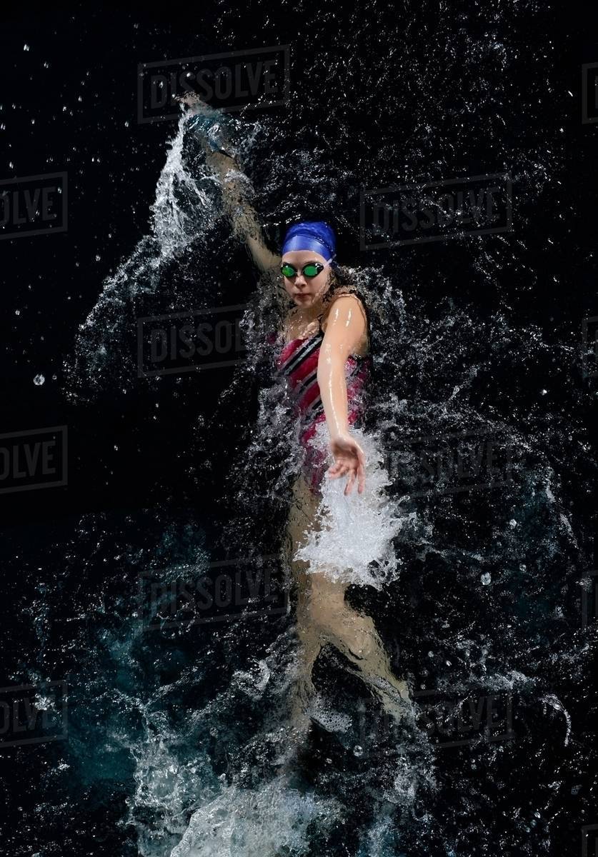 Teenage girl doing backstroke in swimming pool - Royalty-free Stock ...
