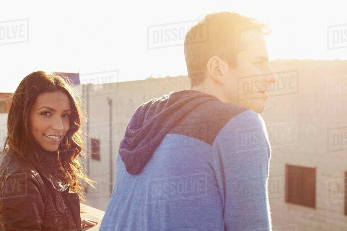 Couple on roof top - Stock Photo - Dissolve
