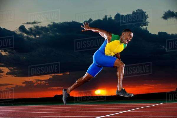 Runner reaching finish line - Stock Photo - Dissolve