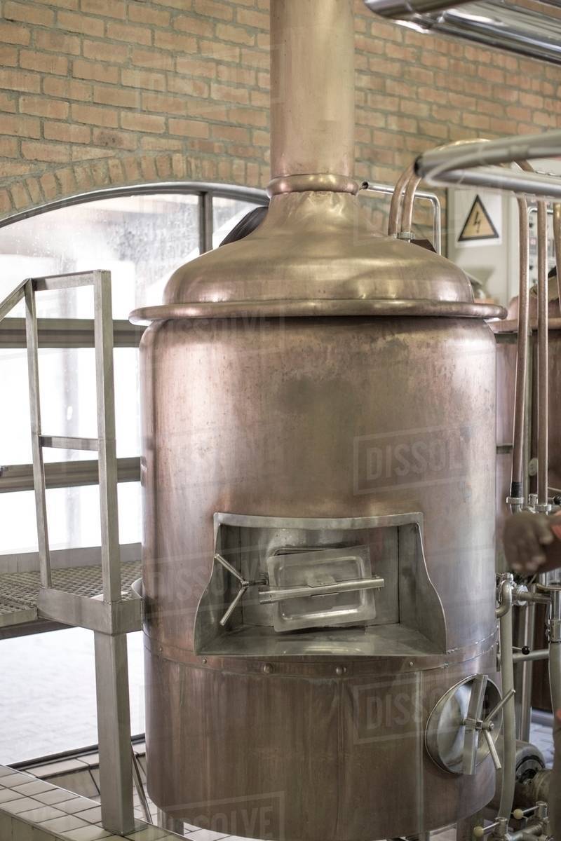 Copper kettle in beer brewery - Stock Photo - Dissolve