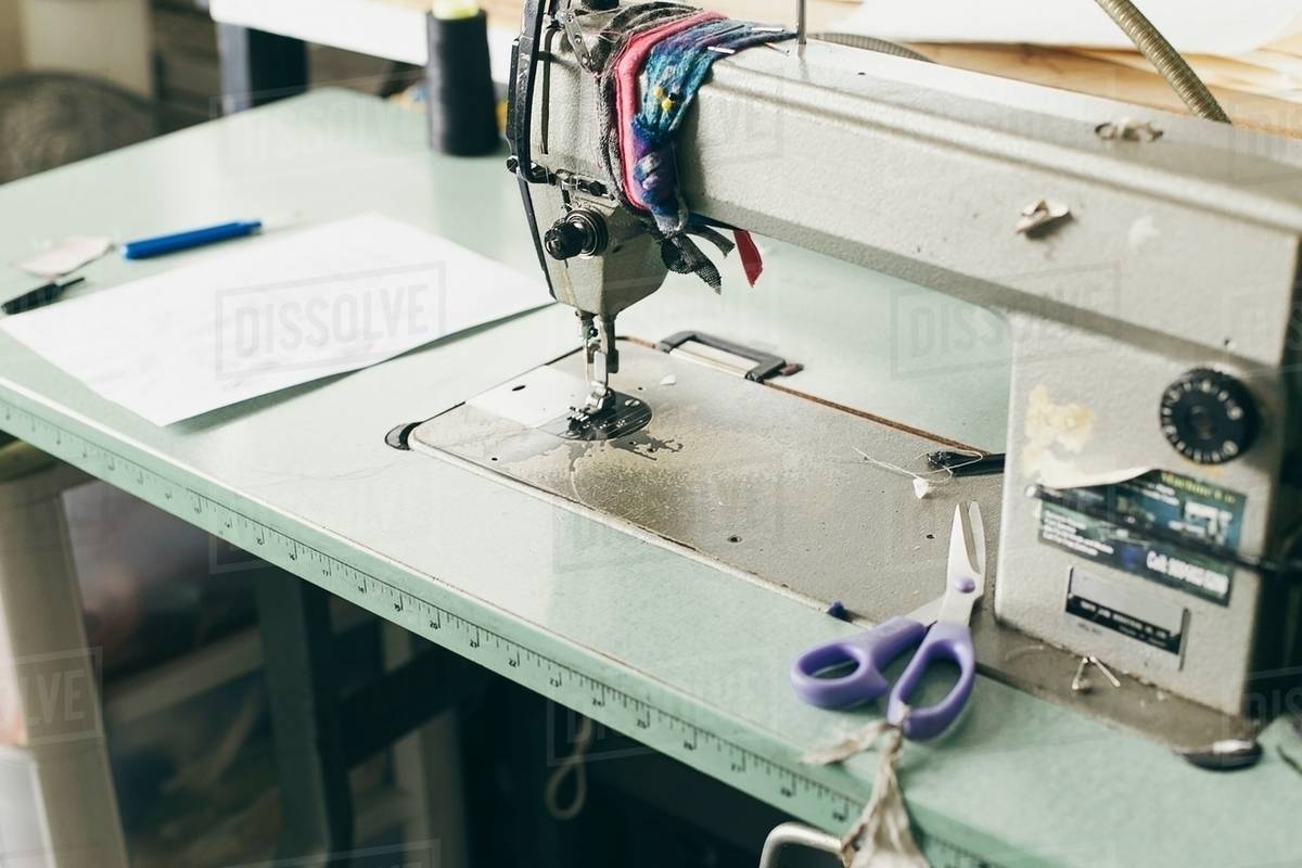 Sewing machine and scissors in fashion studio - Royalty-free Stock ...