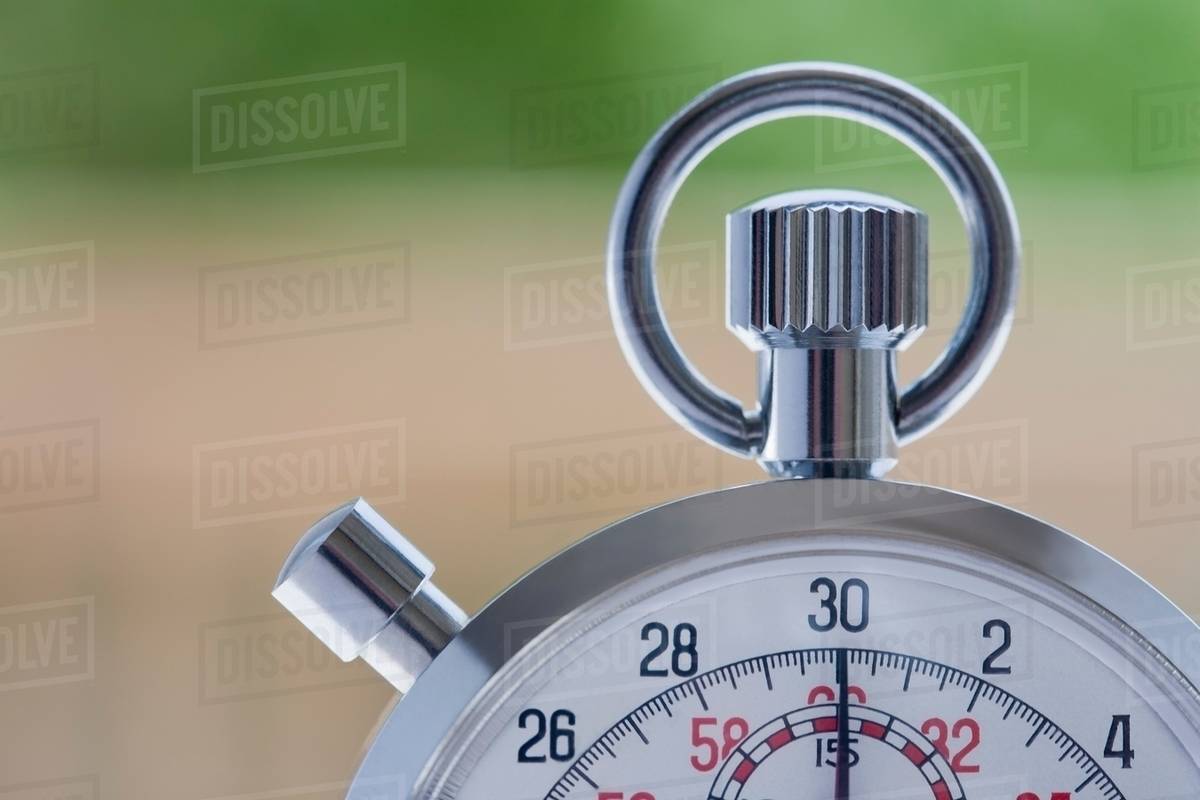 Cropped shot of silver stop watch - Royalty-free Stock Photo | Dissolve