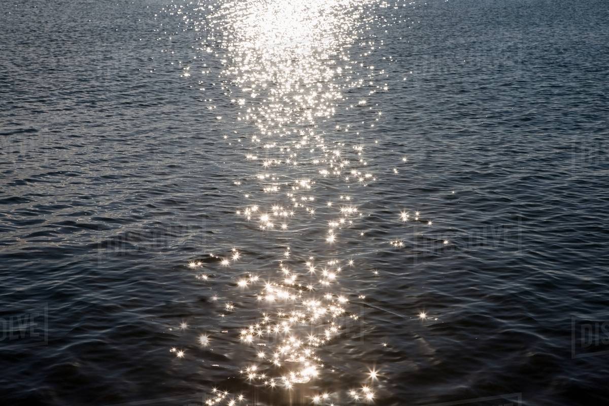 Sun reflected in sea - Stock Photo - Dissolve