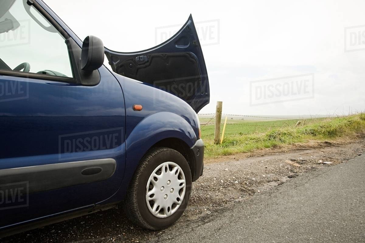 Car with bonnet open - Stock Photo - Dissolve