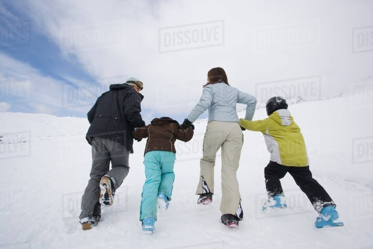 Family in the snow - Royalty-free Stock Photo | Dissolve