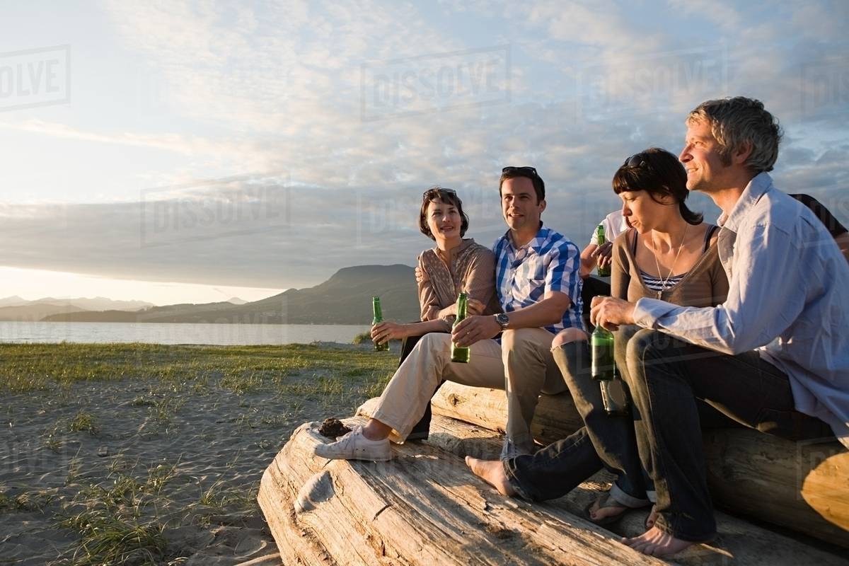 Four friends relaxing on an island - Royalty-free Stock Photo | Dissolve