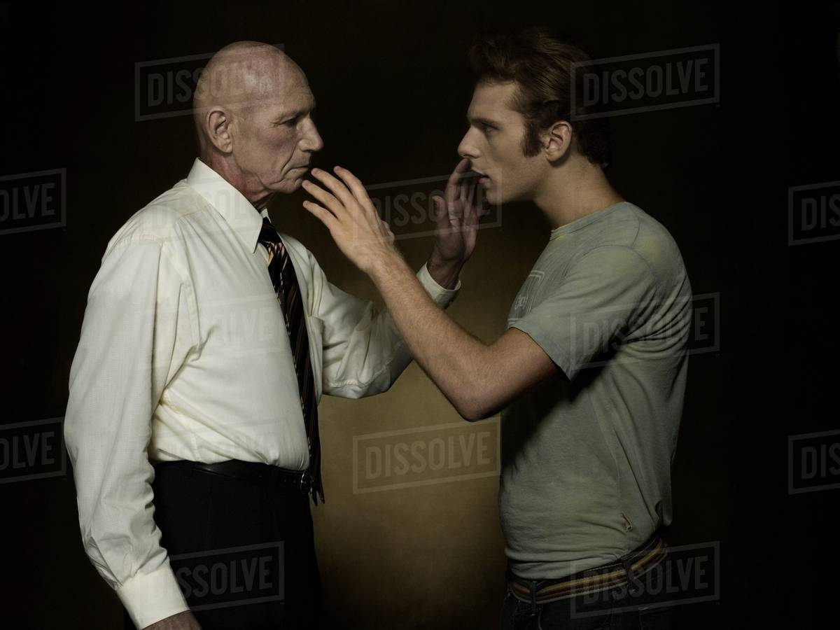 A mature and young man face to face - Royalty-free Stock Photo | Dissolve