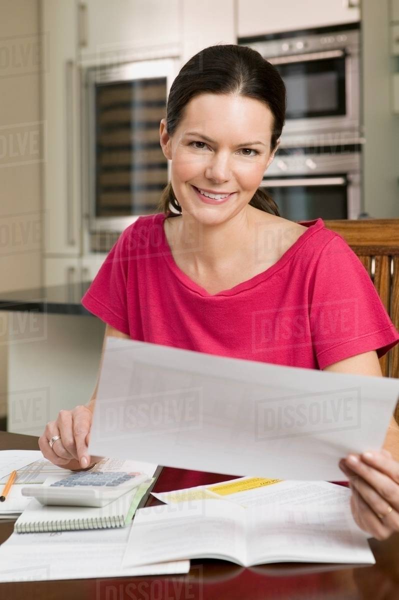 Woman with paperwork - Royalty-free Stock Photo | Dissolve