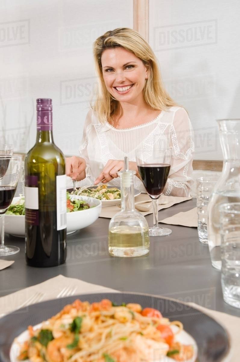 Portrait of a woman at a dinner party - Royalty-free Stock Photo | Dissolve