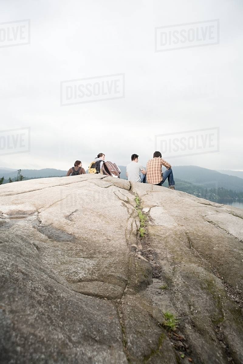People on a rock - Stock Photo - Dissolve