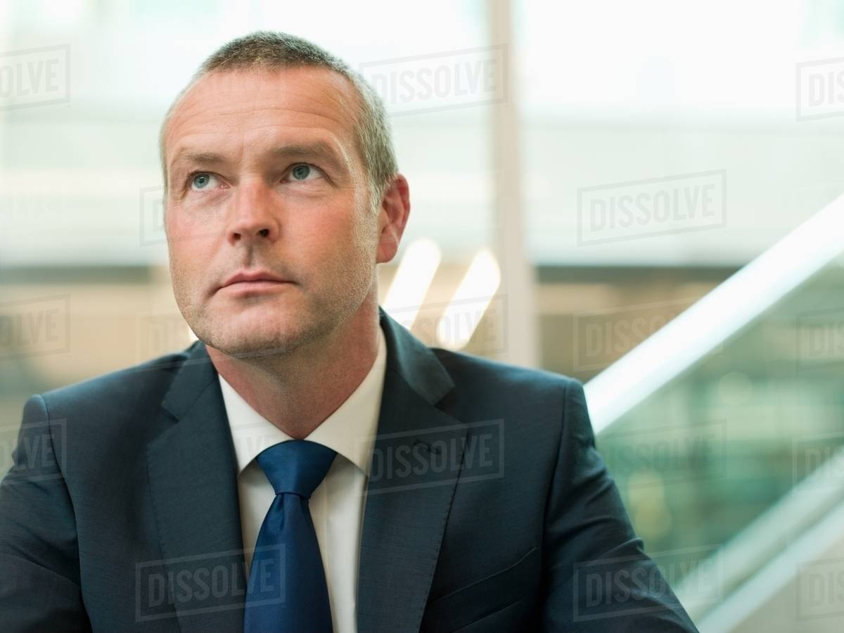 Businessman looking up - Royalty-free Stock Photo | Dissolve