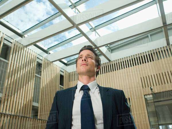 Businessman looking up - Royalty-free Stock Photo | Dissolve