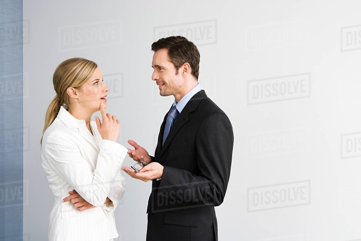 Colleagues having discussion - Stock Photo - Dissolve