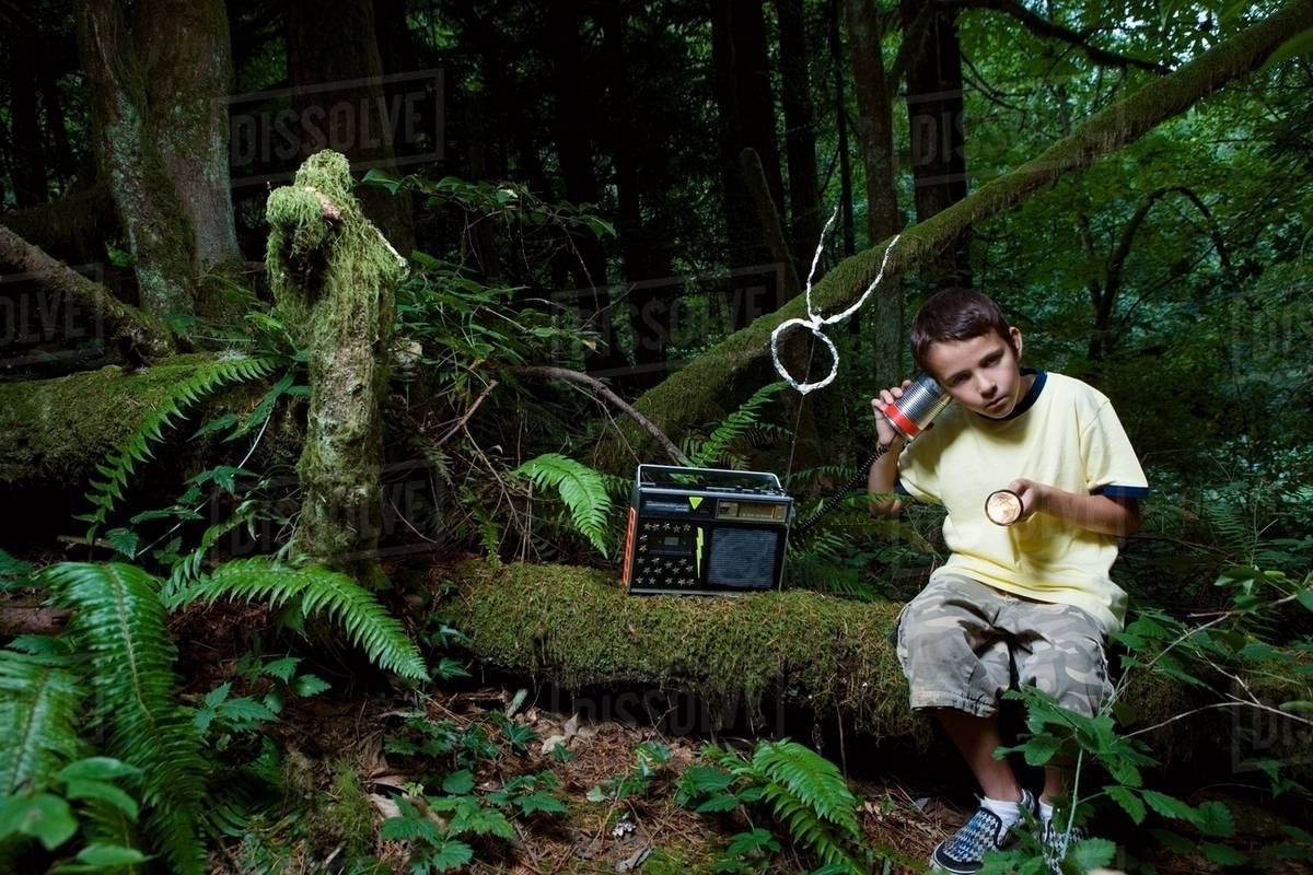 Boy using radio - Stock Photo - Dissolve