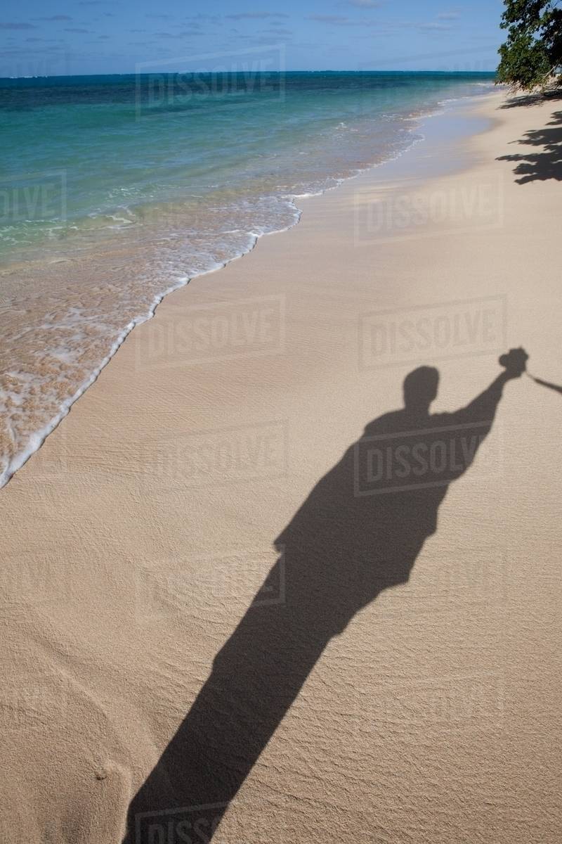 Shadow on the beach. - Stock Photo - Dissolve