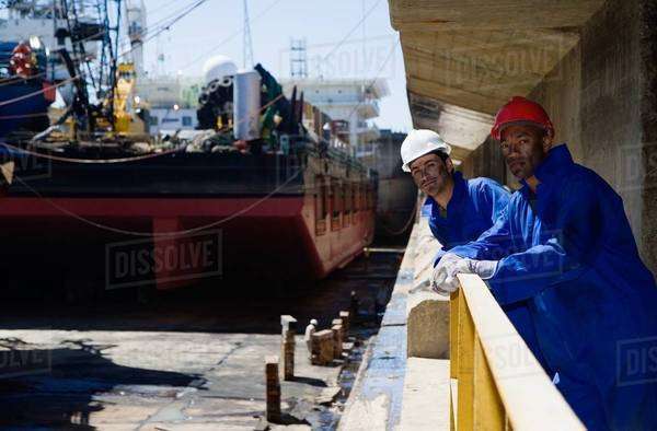 Portrait of two harbour workers - Royalty-free Stock Photo | Dissolve
