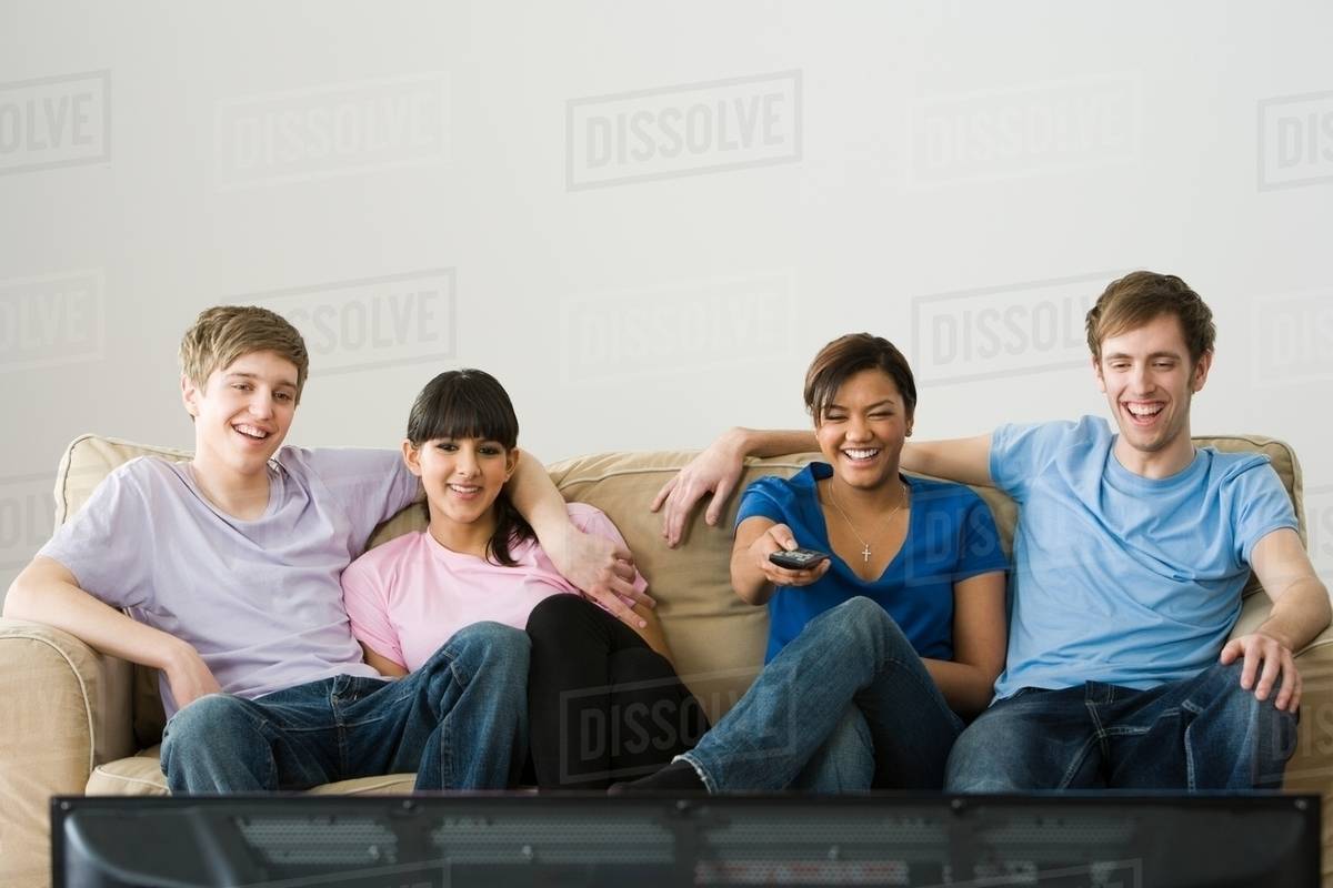 Friends watching tv - Stock Photo - Dissolve