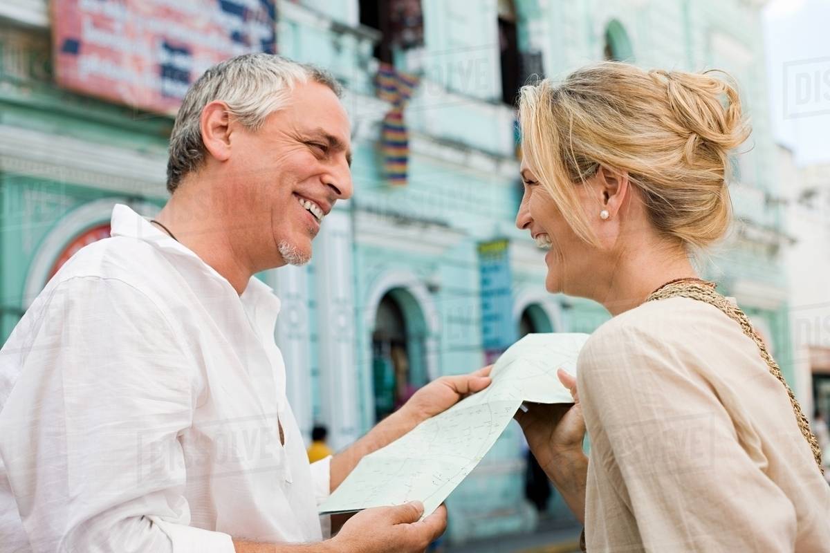 Couple with map - Royalty-free Stock Photo | Dissolve